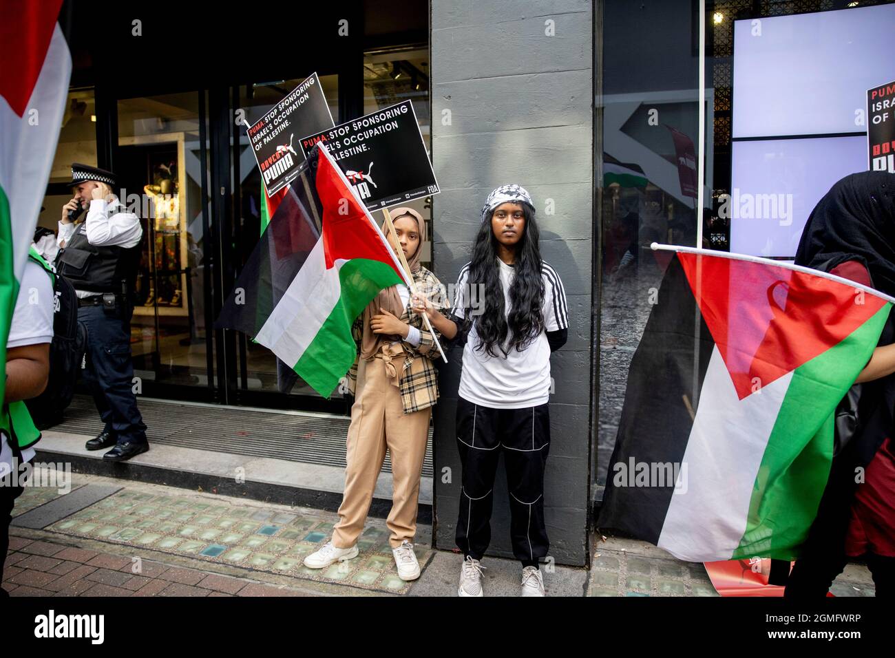 London, UK. 18th Sep, 2021. Two young Palestinian supporters holding ...