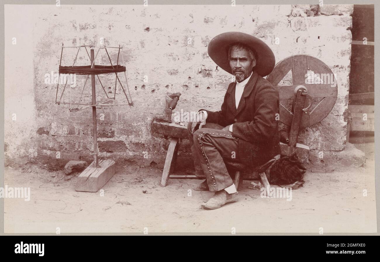 Mexican weaver sitting next to a wooden spinning wheel, Old Mexico1898 ...