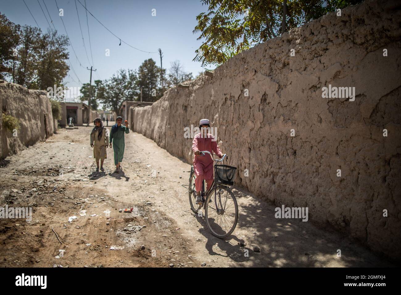 Isa Khel, Afghanistan. 17th Sep, 2021. An Afghani boy rides a bike in ...