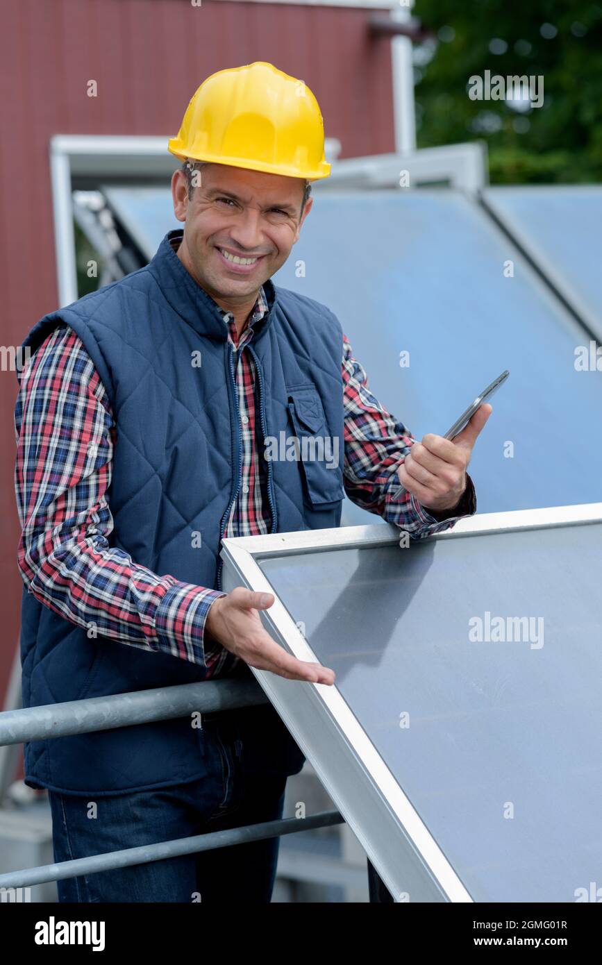 portrait of man presenting solar panel Stock Photo - Alamy
