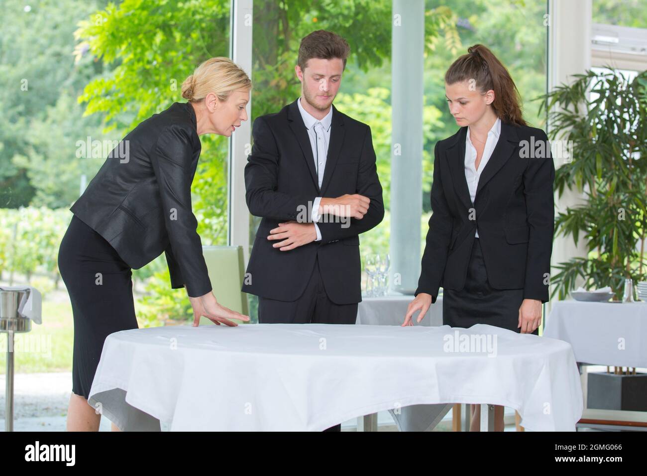 restaurant manager administrating an event Stock Photo - Alamy