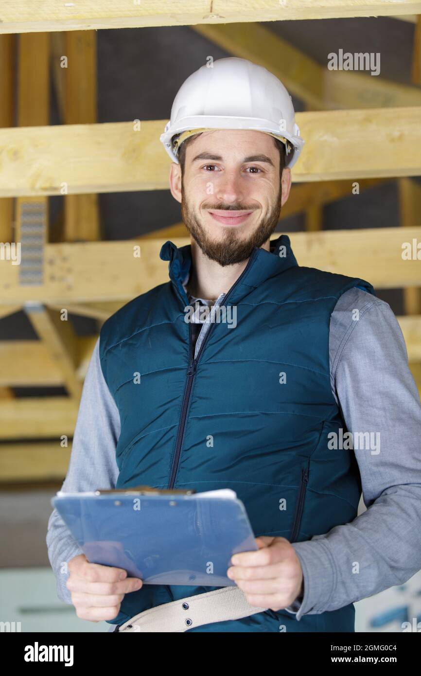 building inspector looking at new property Stock Photo - Alamy