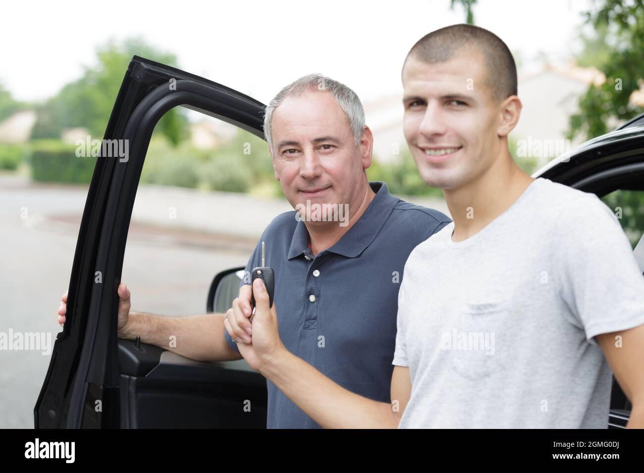 Father giving key son hi-res stock photography and images - Alamy