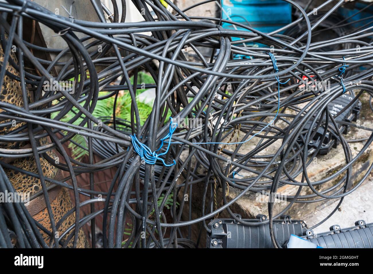 Closeup shot of messy electricity wires outside of residential house ...