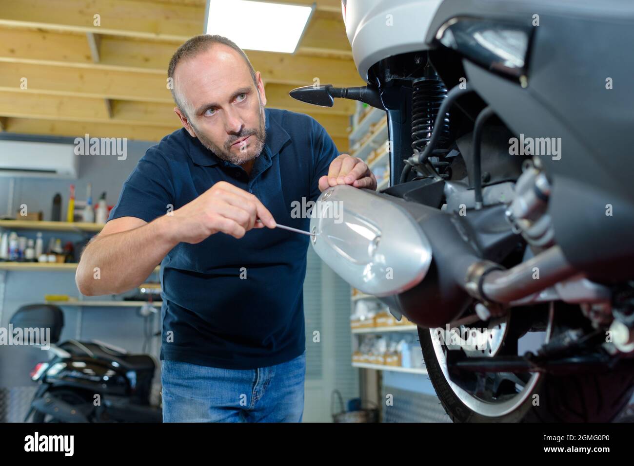 Fixing a motorbike hi-res stock photography and images - Alamy