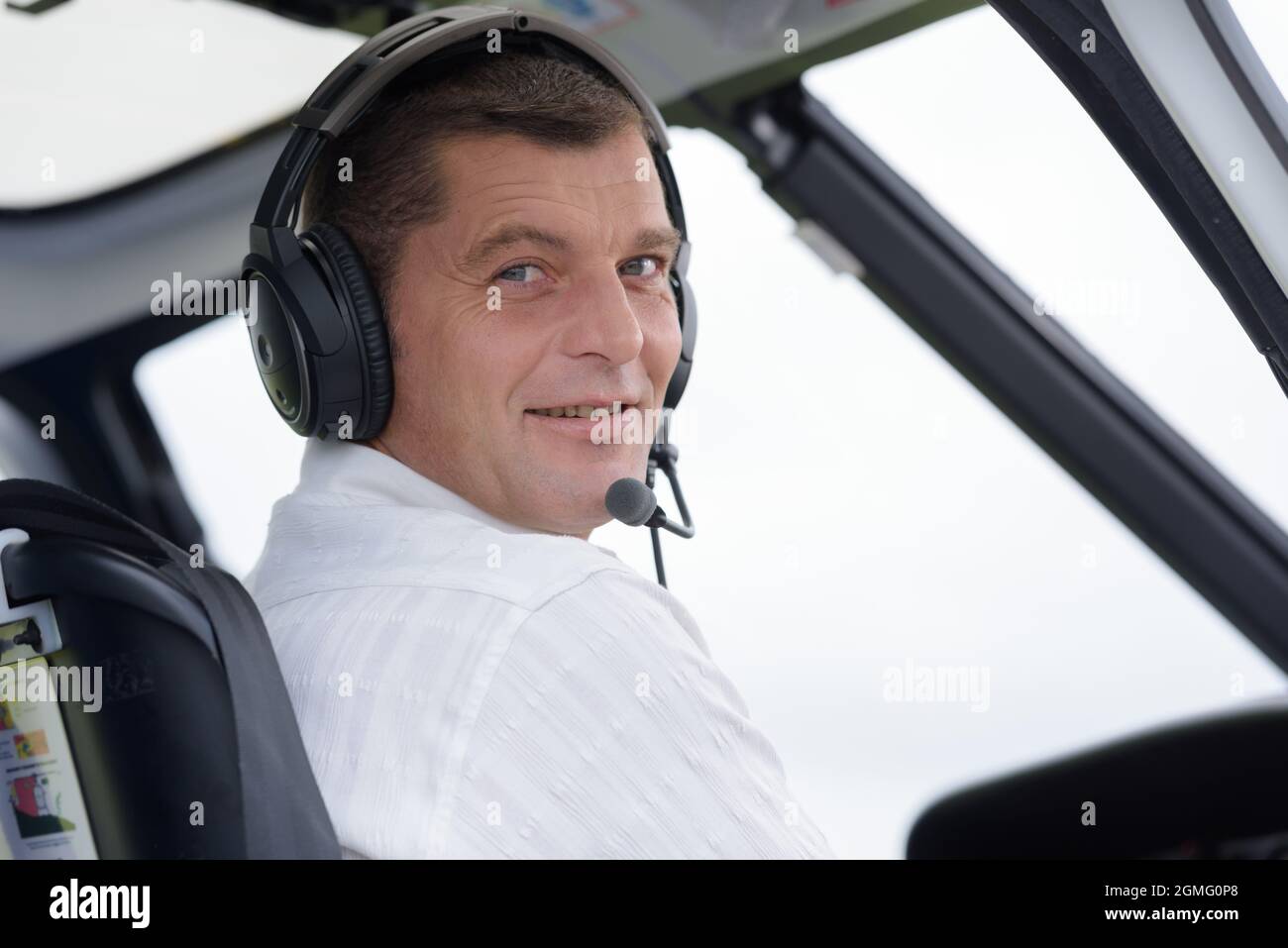pilot in cockpit of helicopter during flight Stock Photo - Alamy