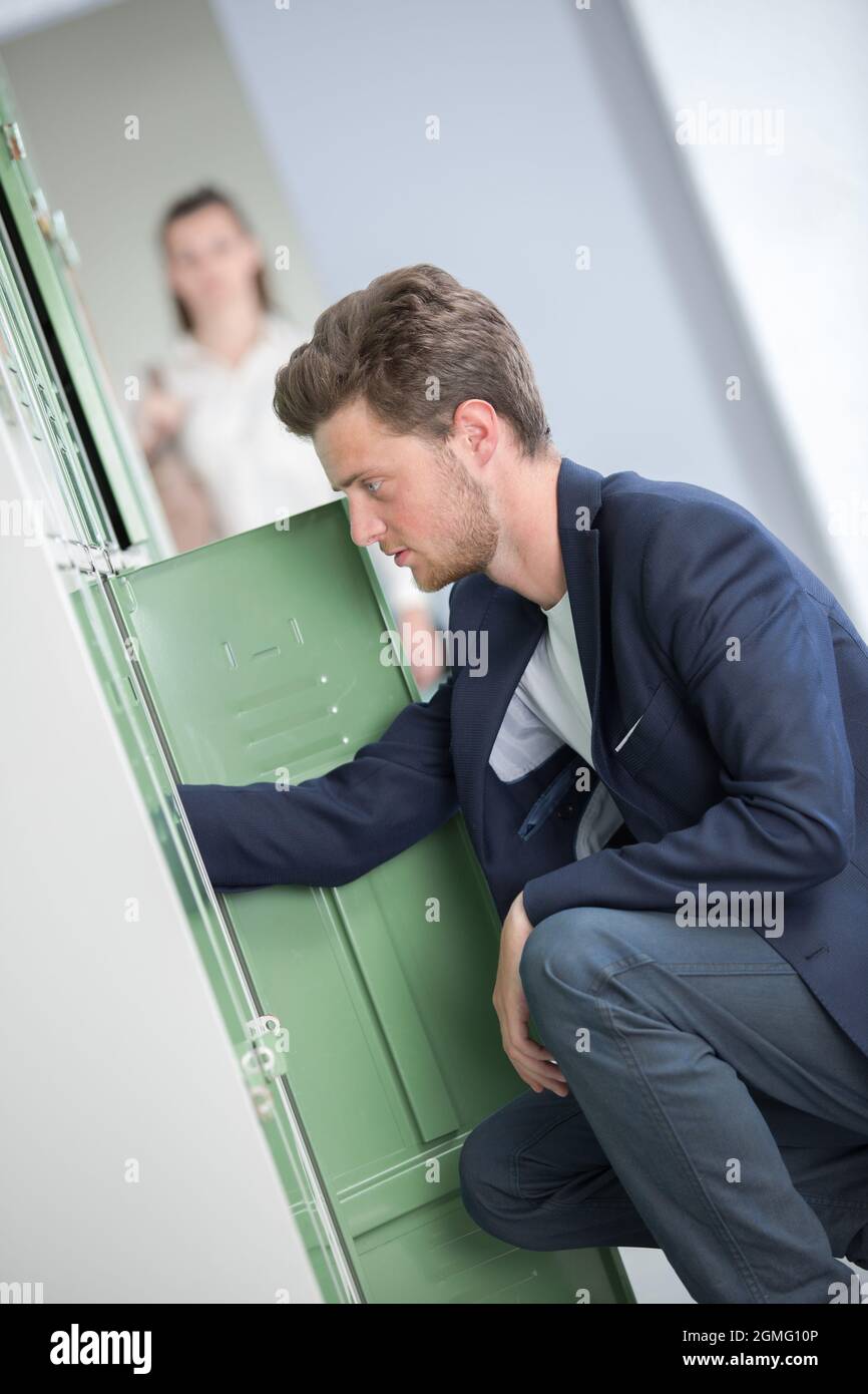 young man next to school lockers Stock Photo - Alamy