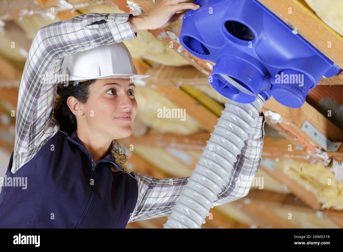 women working a pvc pipe Stock Photo - Alamy