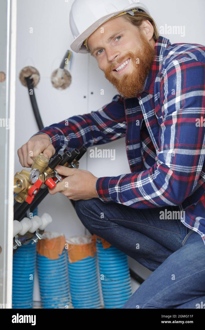 happy plumber man installing water meter device Stock Photo - Alamy happy plumber man installing water meter device Stock Photo - Alamy