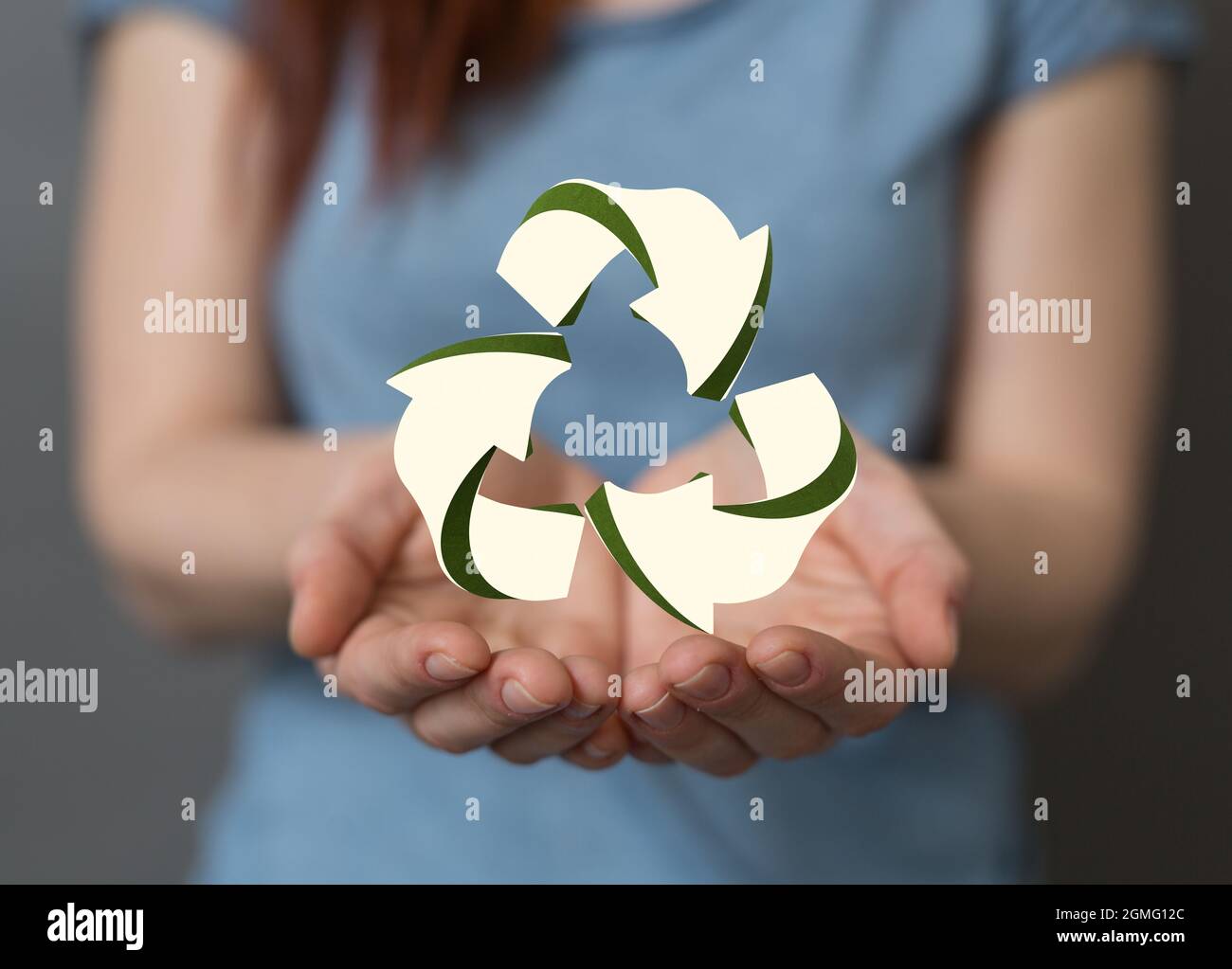 Female hands with 3d rendered of recycling green symbol with graphics ...