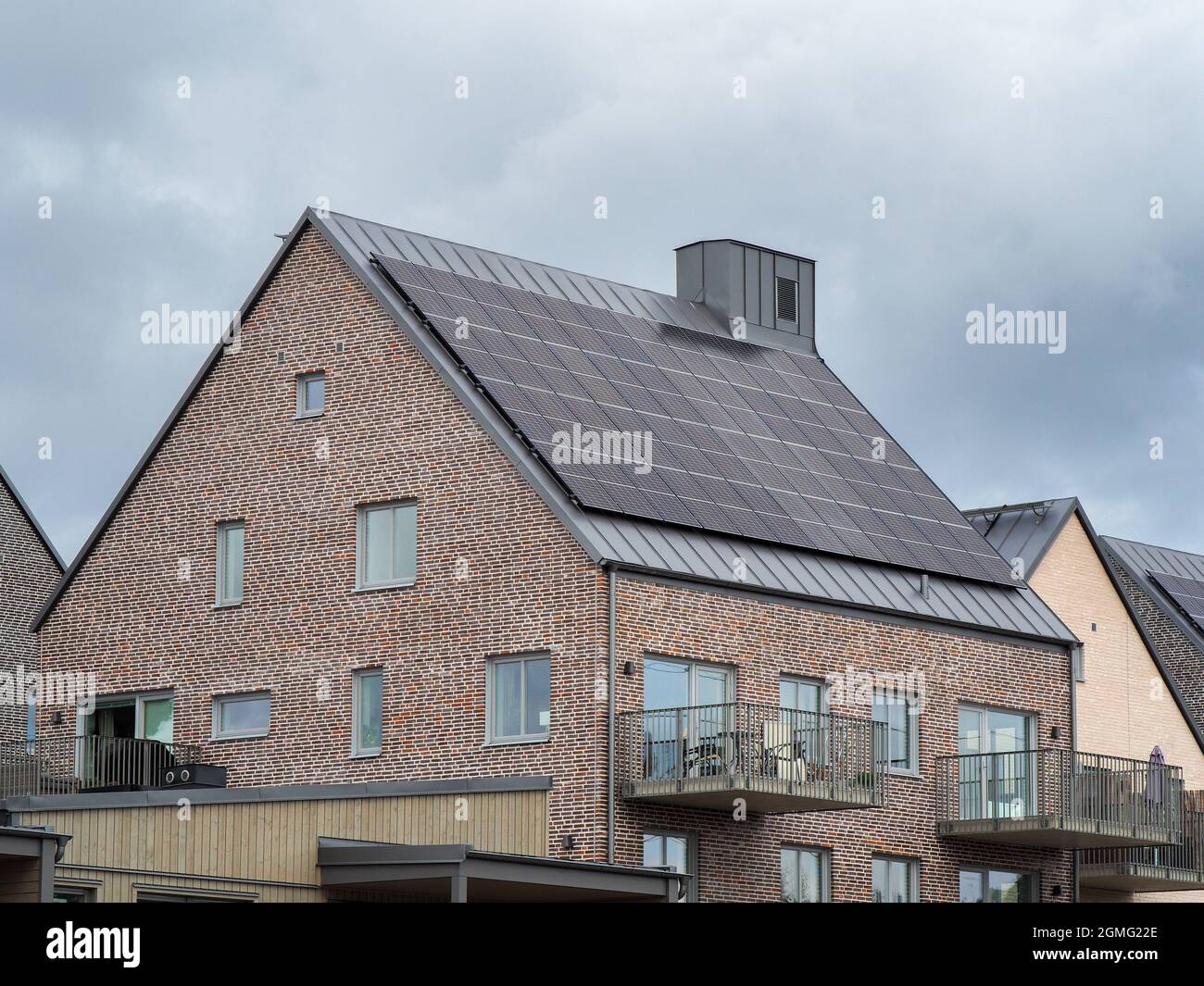 Modern house with solar panels on the gable roof Stock Photo - Alamy