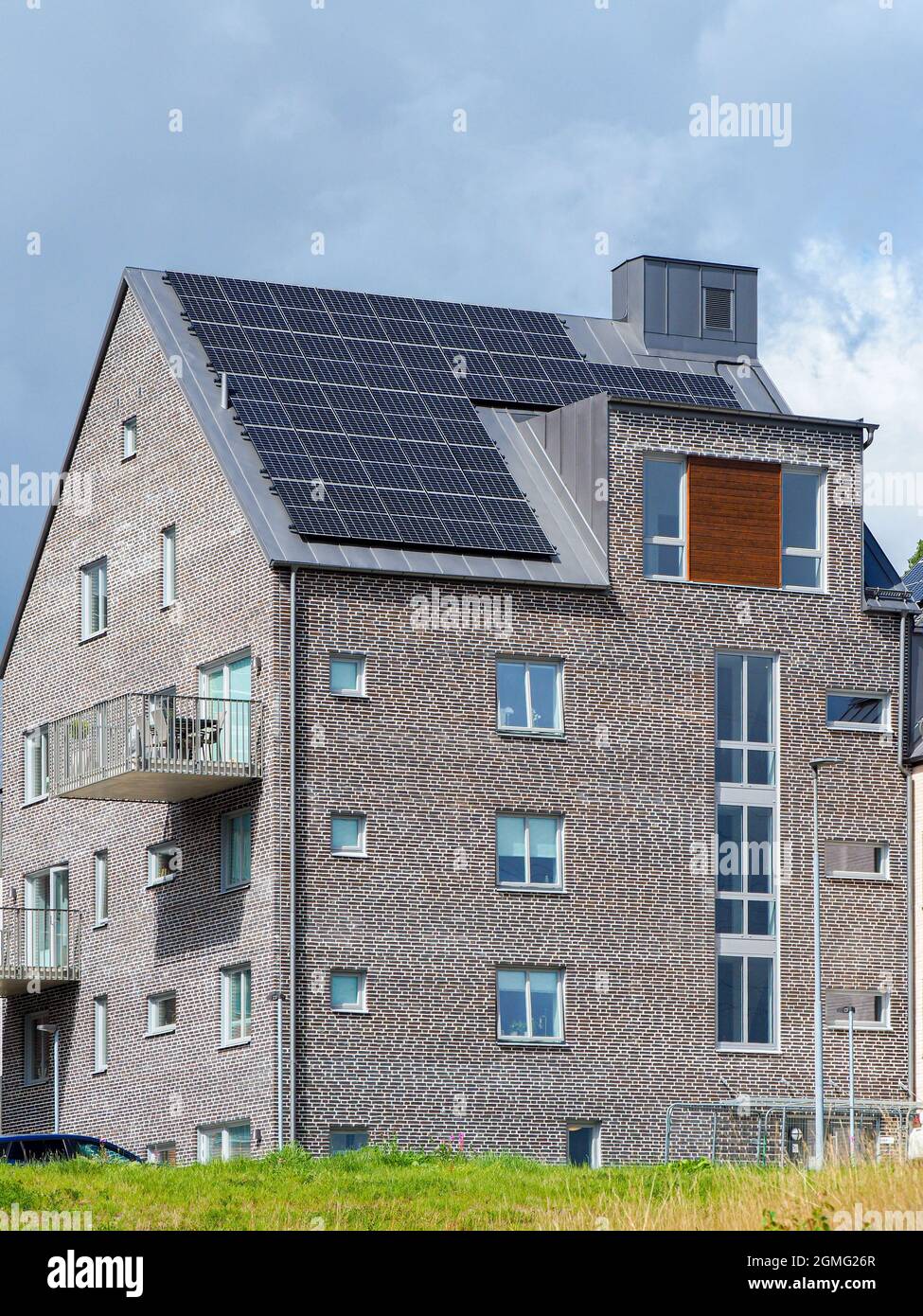 Modern house with solar panels on the gable roof Stock Photo - Alamy