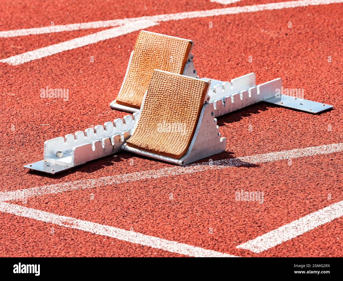 Starting blocks on the stadium treadmill in the summer Stock Photo - Alamy