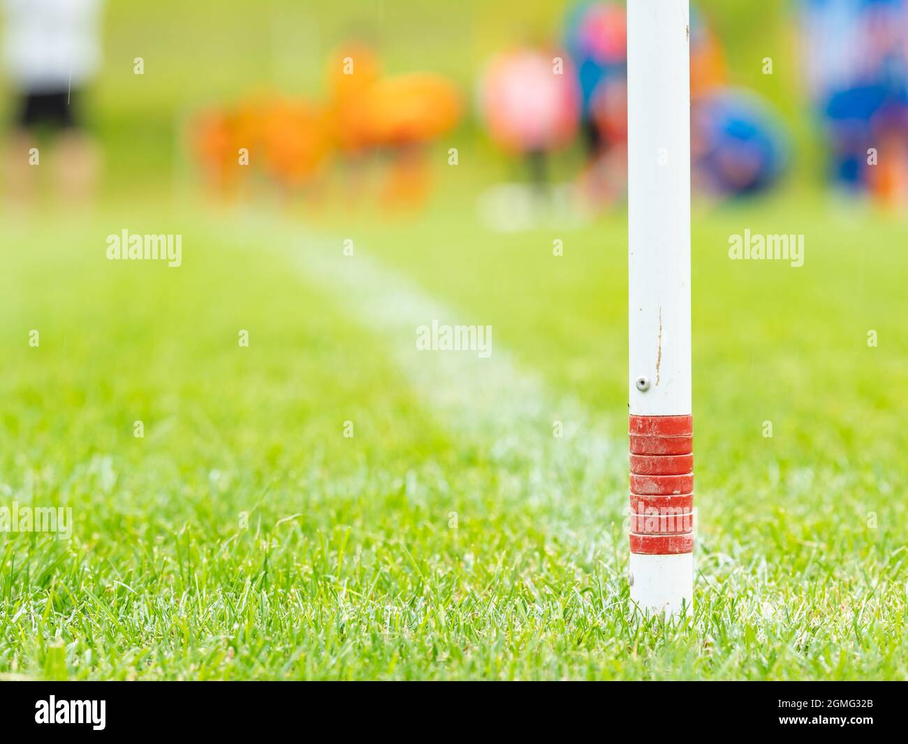 Corner kick spot on artificial grass football stadium, players in blue ...