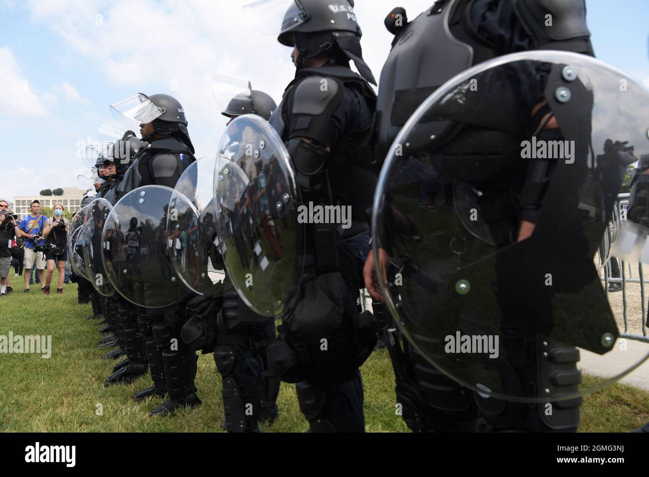 Police Officer in riot gear stand guard during a rally about ÒJustice ...