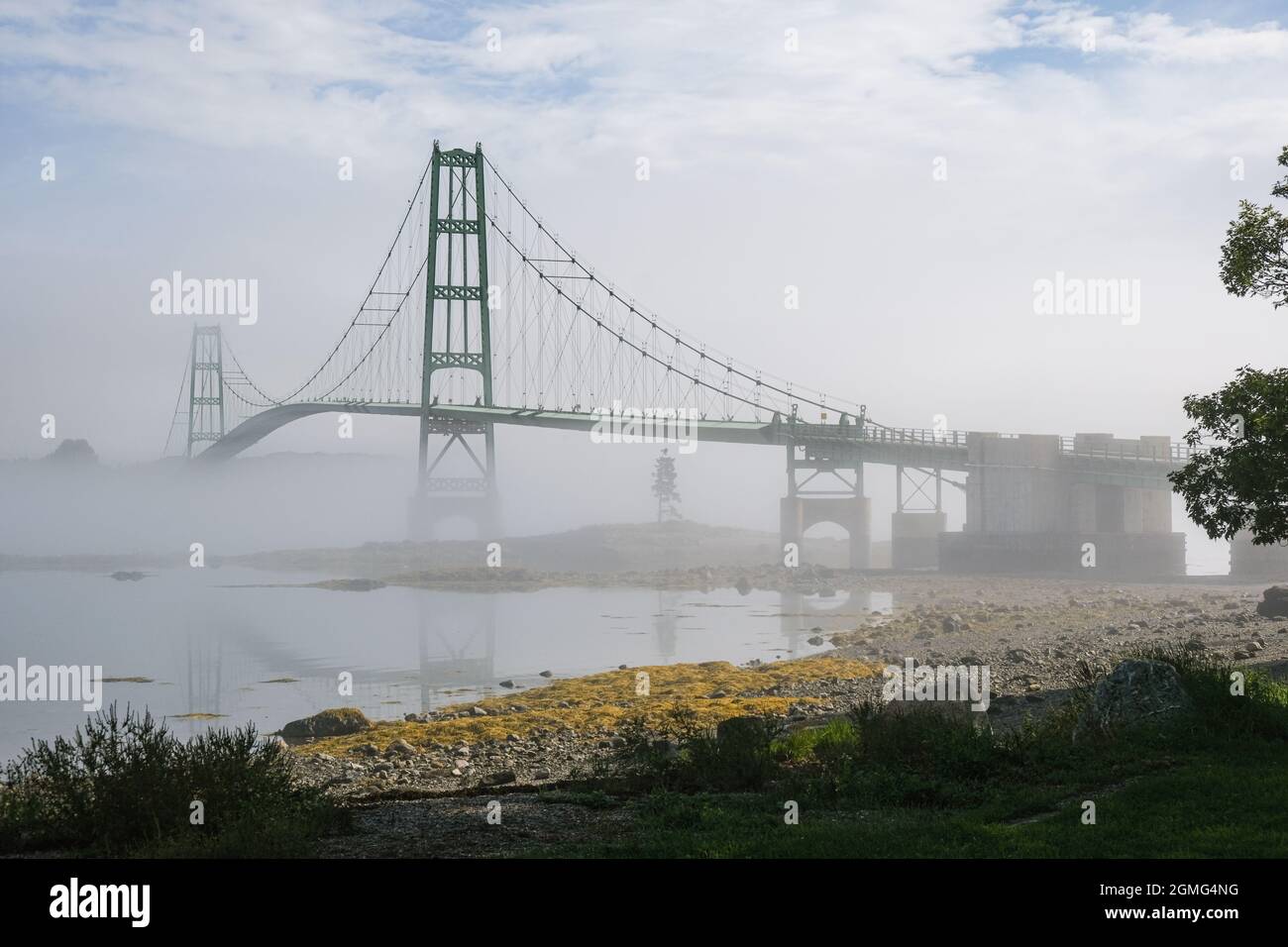 A beautiful scene of the historic Deer Isle Bridge in coastal Maine on ...