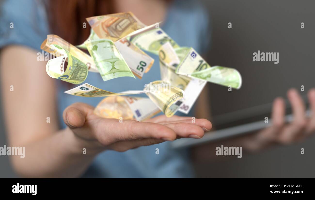 Female hand and rain of euro banknotes; concept of business and economy ...