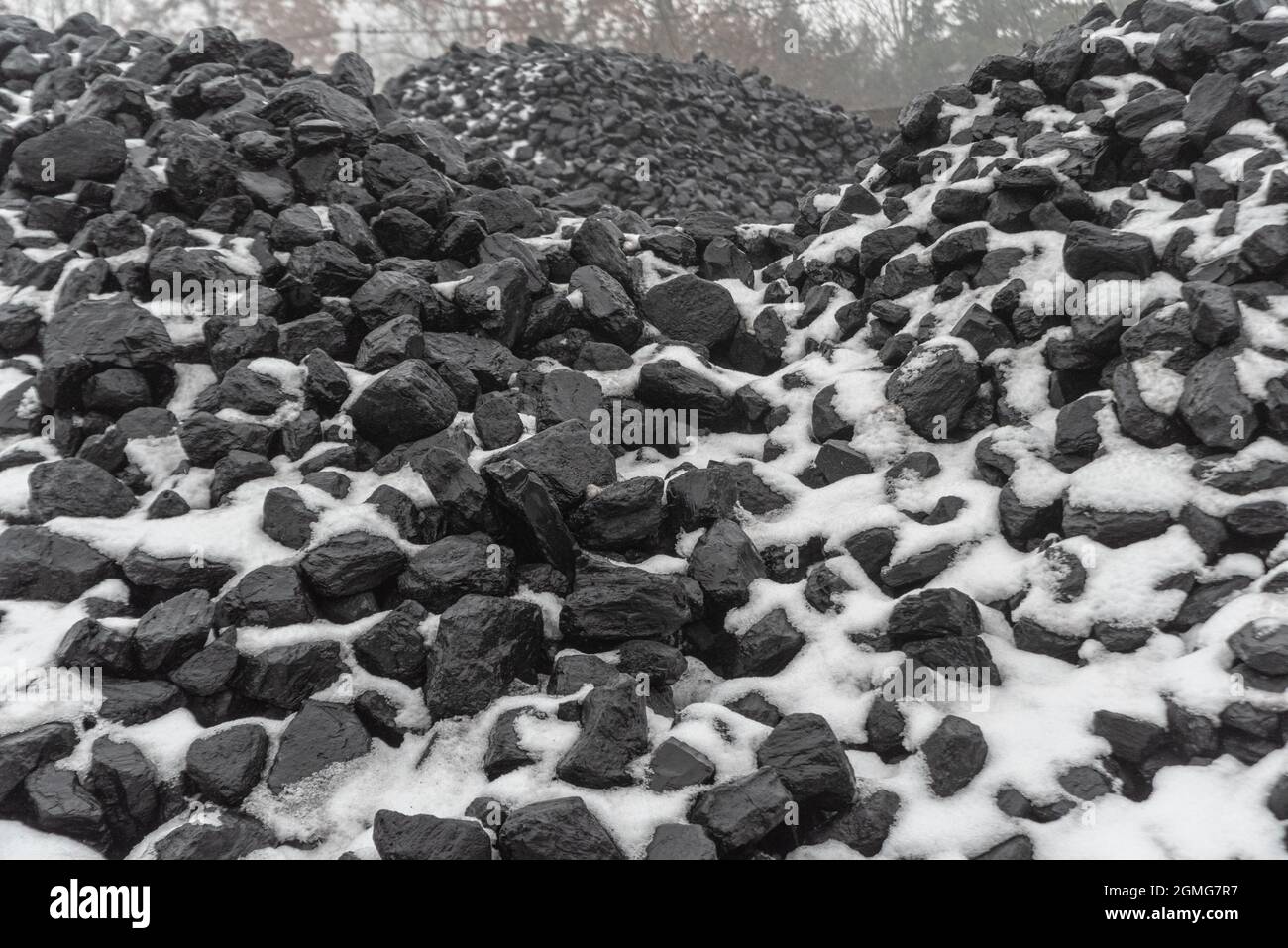 Coal and snow. Fuel composition in winter. Hard coal for sale. Fuel for ...