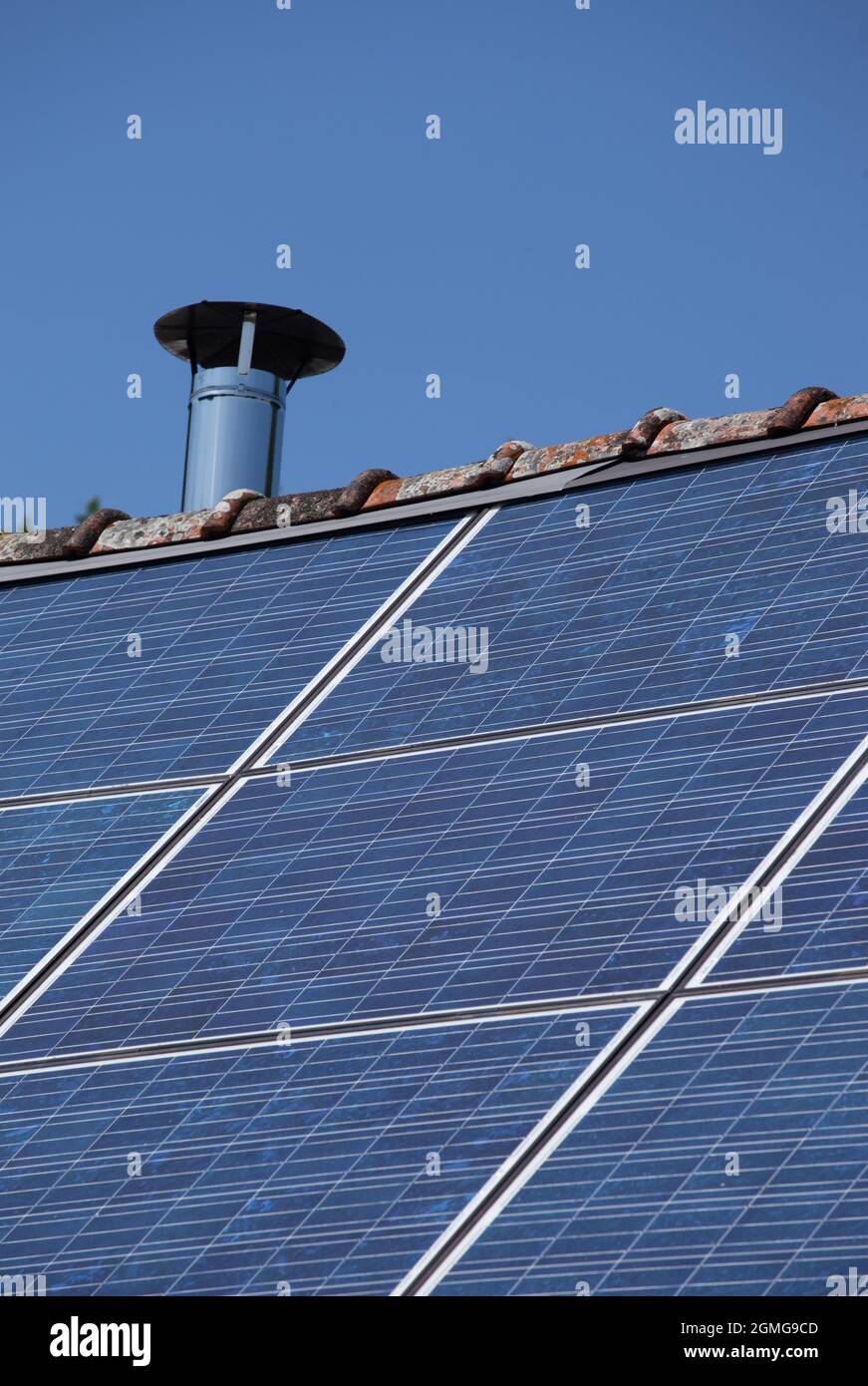 Closeup of solar panels installed on a building roof; solar ...