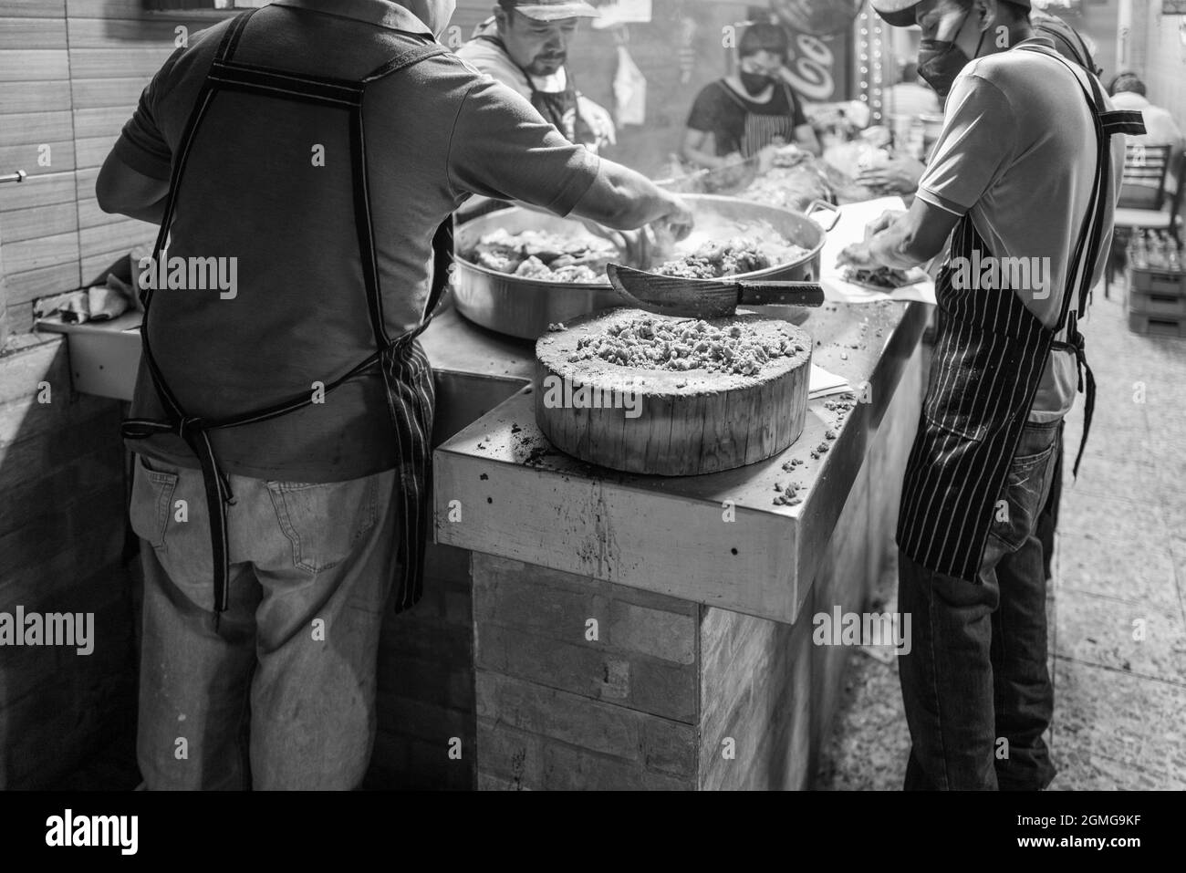 Street food eating Black and White Stock Photos & Images - Alamy