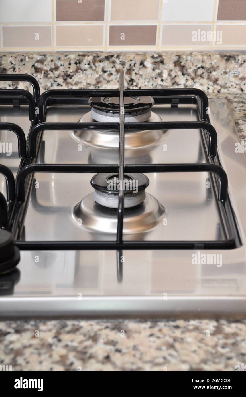 Modern luxurious kitchen and stainless steel chrome built-in gas oven ...