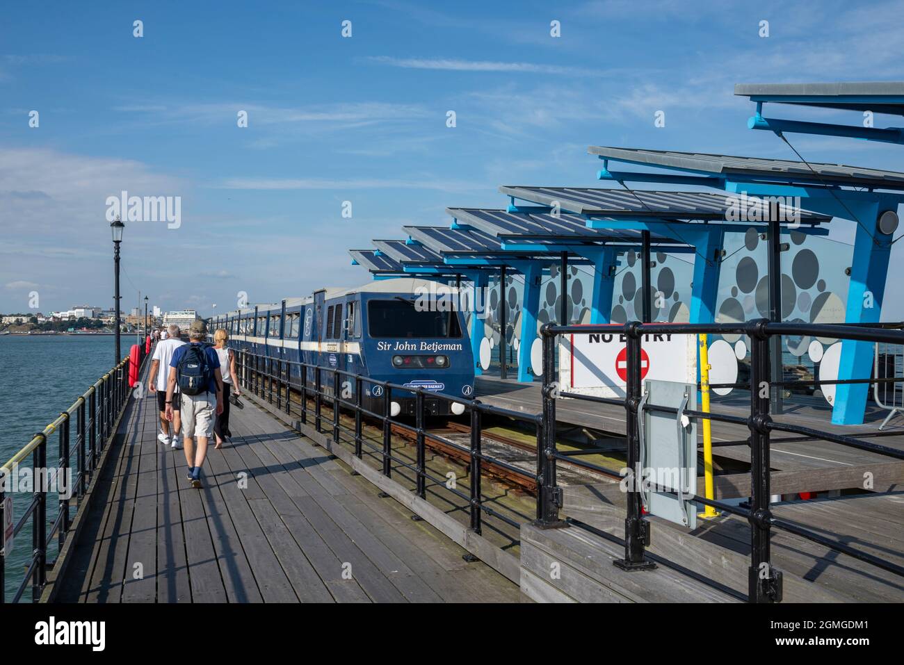Pier train departing the pier end station on Southend Pier with walkers ...