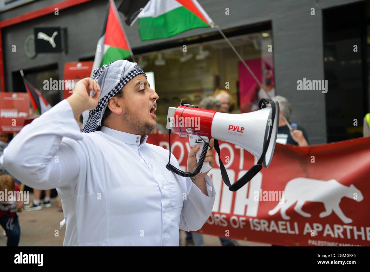 London, UK. 18th Sep, 2021. A protestor shouts through a megaphone ...