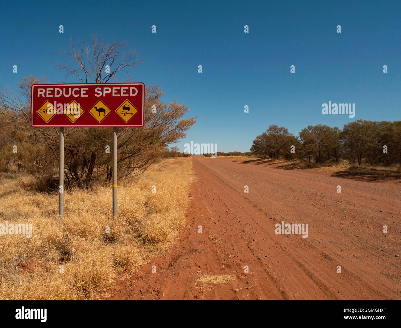 Reduce Speed dangerous driving conditions Road warning sign on Mereenie ...