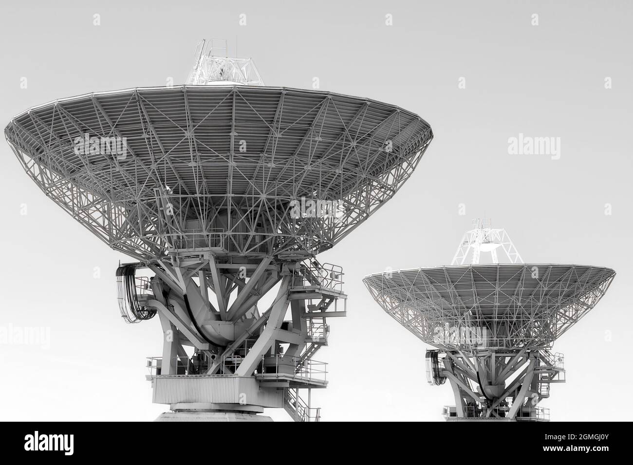 Plain grayscale dishes of two complex scientific antennae - part of ...