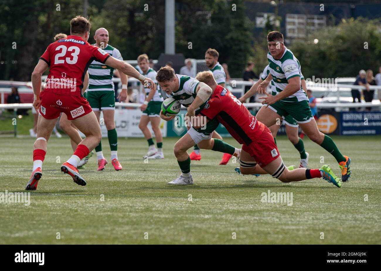 Angus Kernohan of Ealing Trailfinders is tackled by Oli Robinson of ...