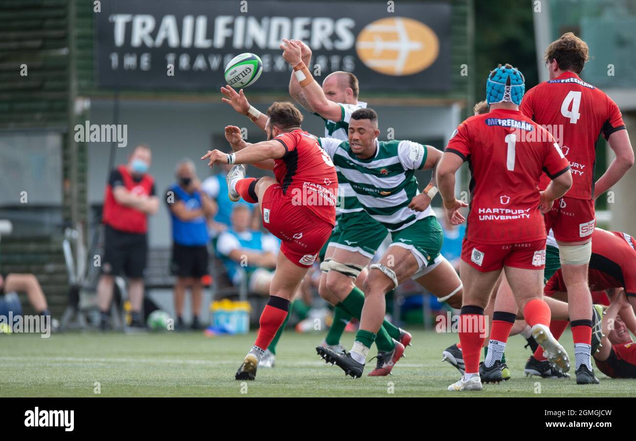 Harry Casson of Ealing Trailfinders blocks a kick from JB Bruzulier of ...