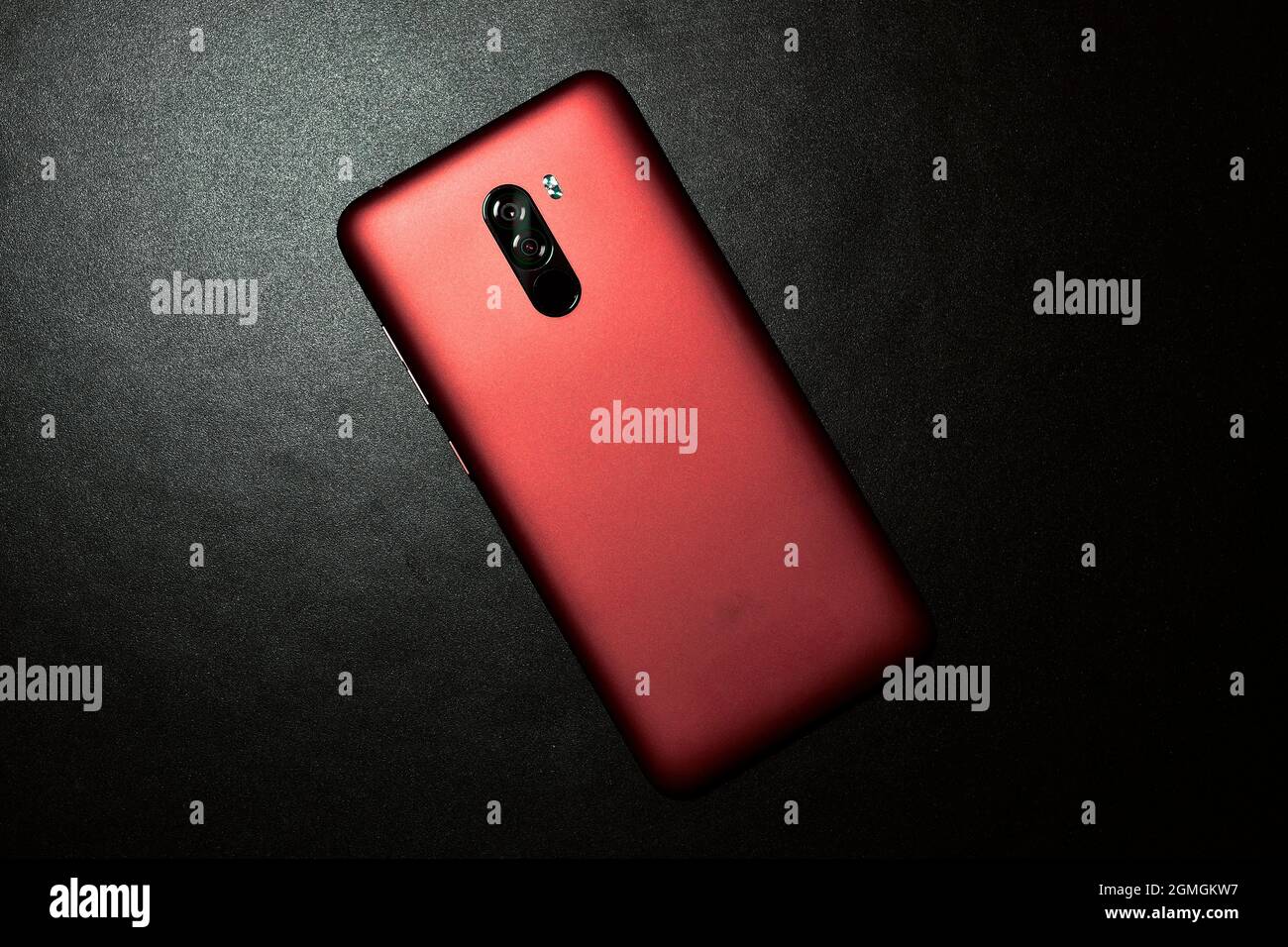 Top View of red color Smartphone on Dark Background Stock Photo - Alamy