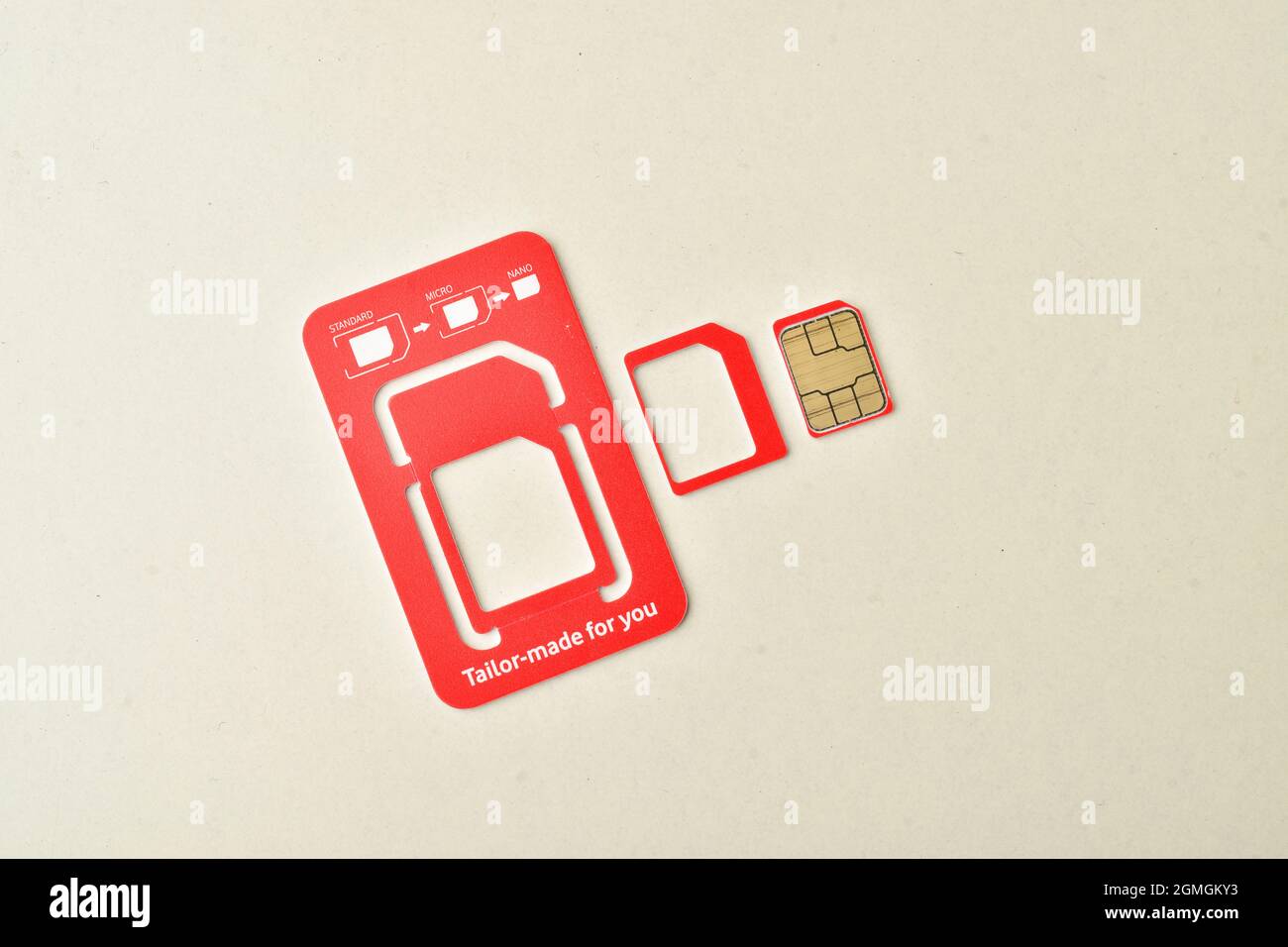 tailored made sim card on white background Stock Photo - Alamy