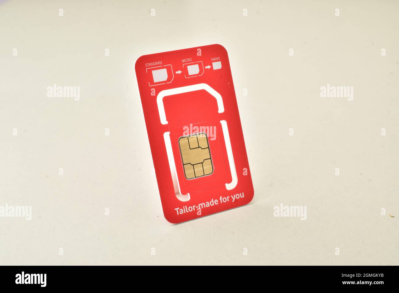 Tailor made sim card isolated on white background Stock Photo - Alamy