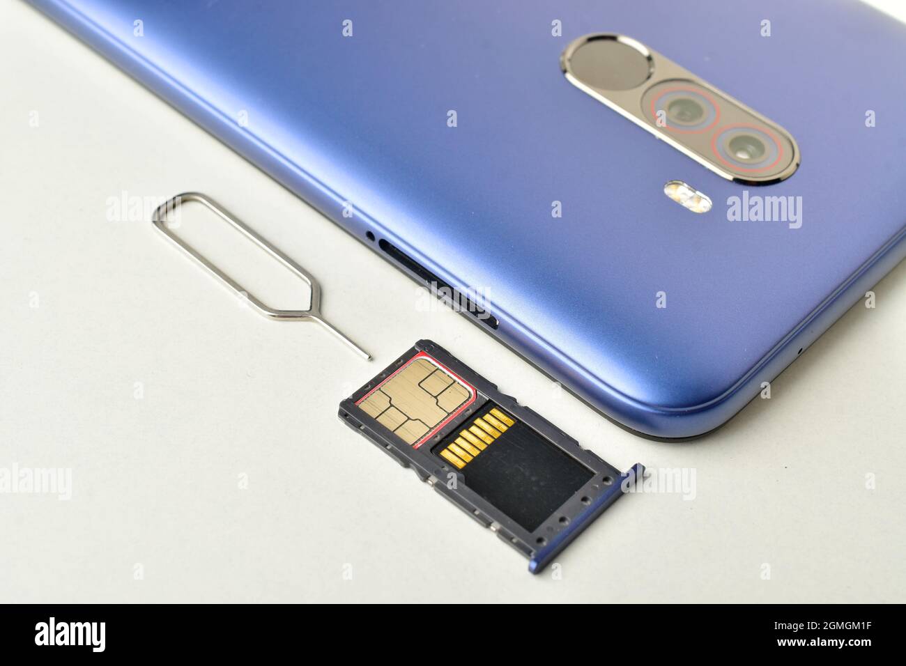 phone with sim ejector and memory card on white background Stock Photo ...