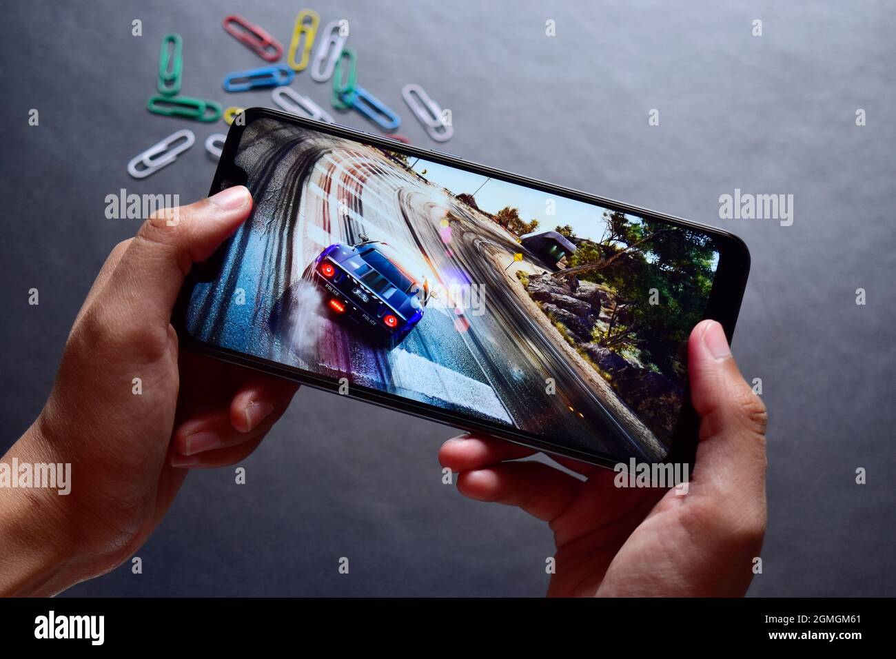 Playing Game on Android Mobile Phone on Dark Background Stock Photo - Alamy