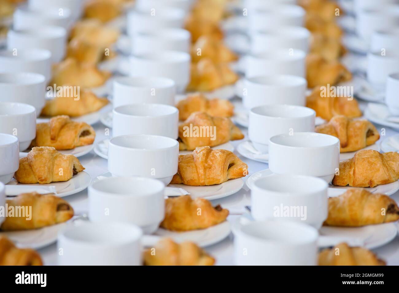 line of croissant waiting for coffee break Stock Photo - Alamy