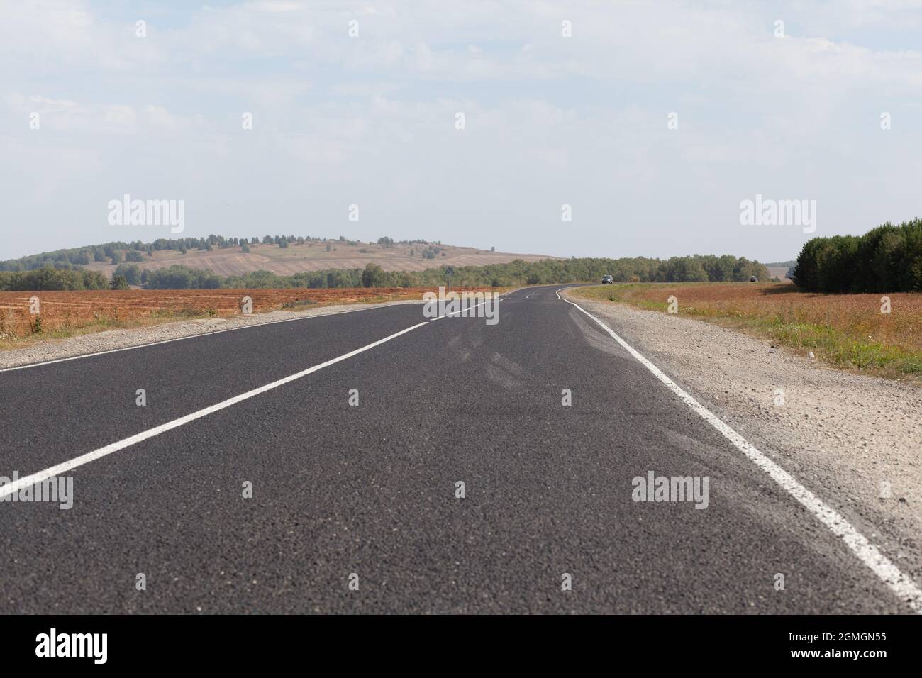 Straight road with a marking on the nature background. Open Road in ...