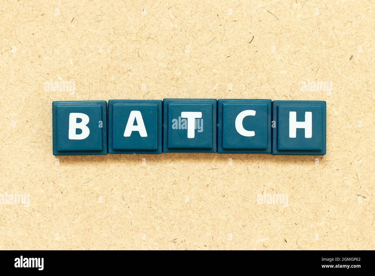 Tile alphabet letter in word batch on wood background Stock Photo - Alamy