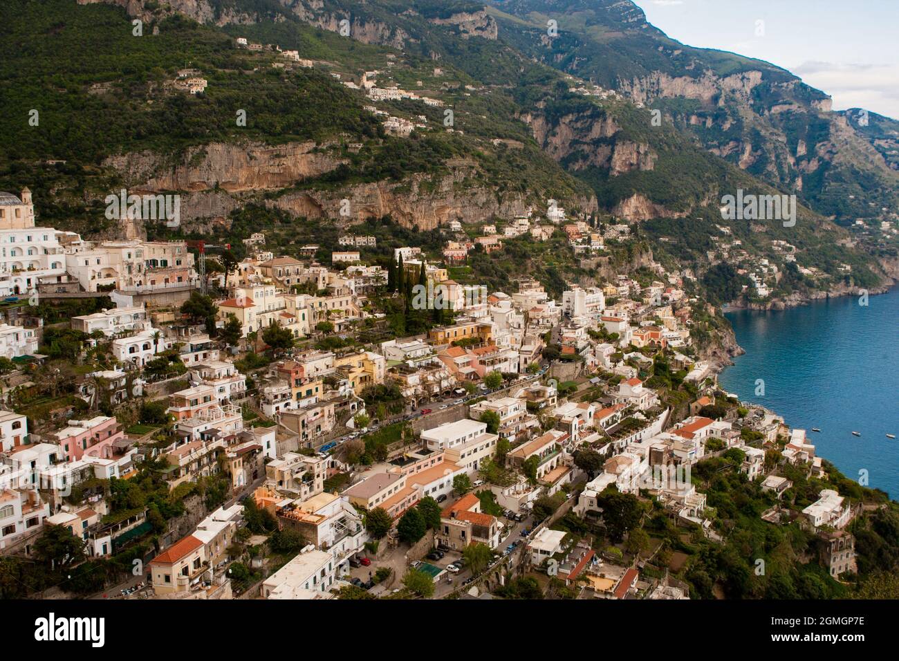 Houses of a scenic seaside village dot the hillside overlooking the ...