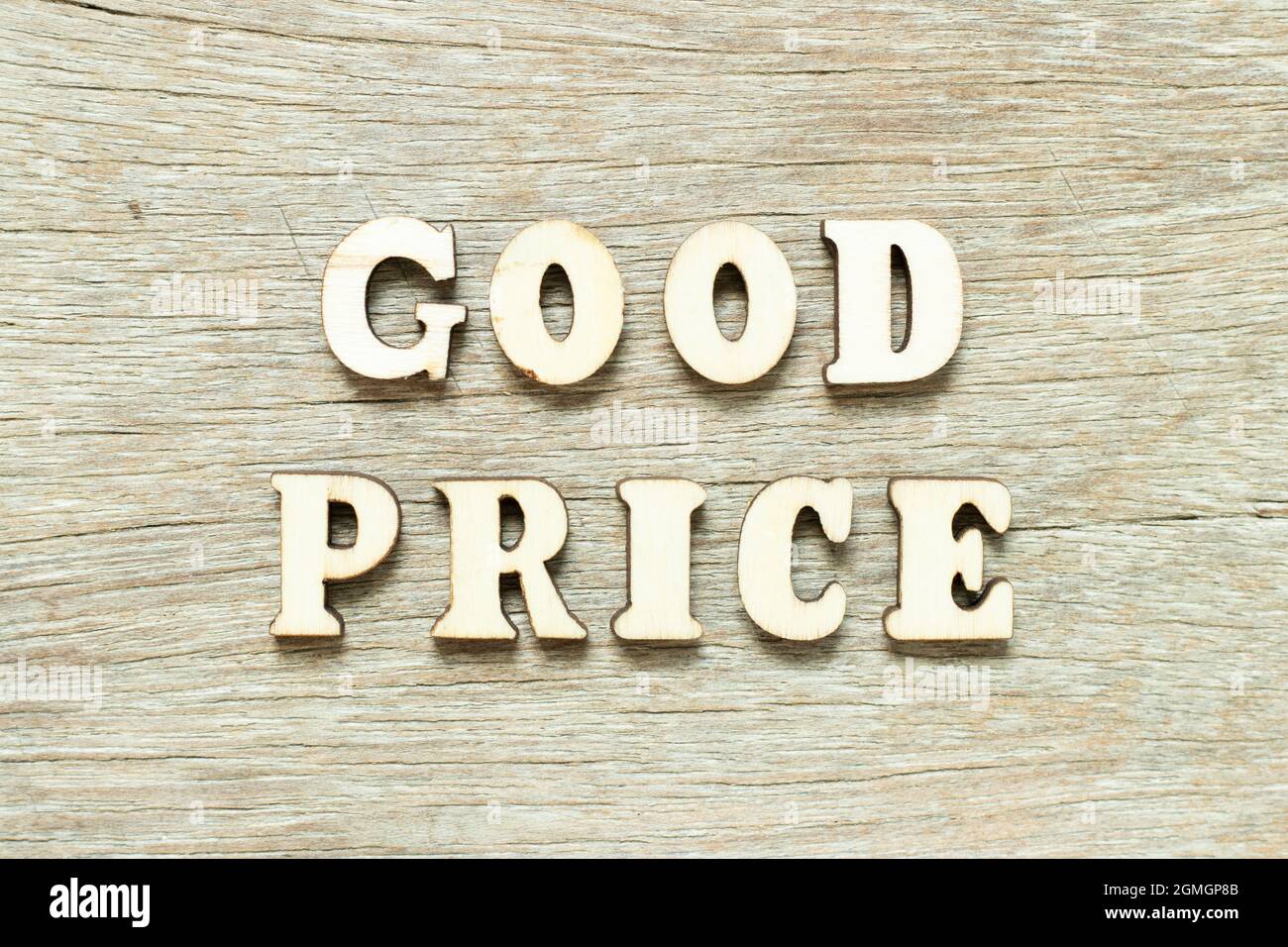 Alphabet letter in word good price on wood background Stock Photo - Alamy