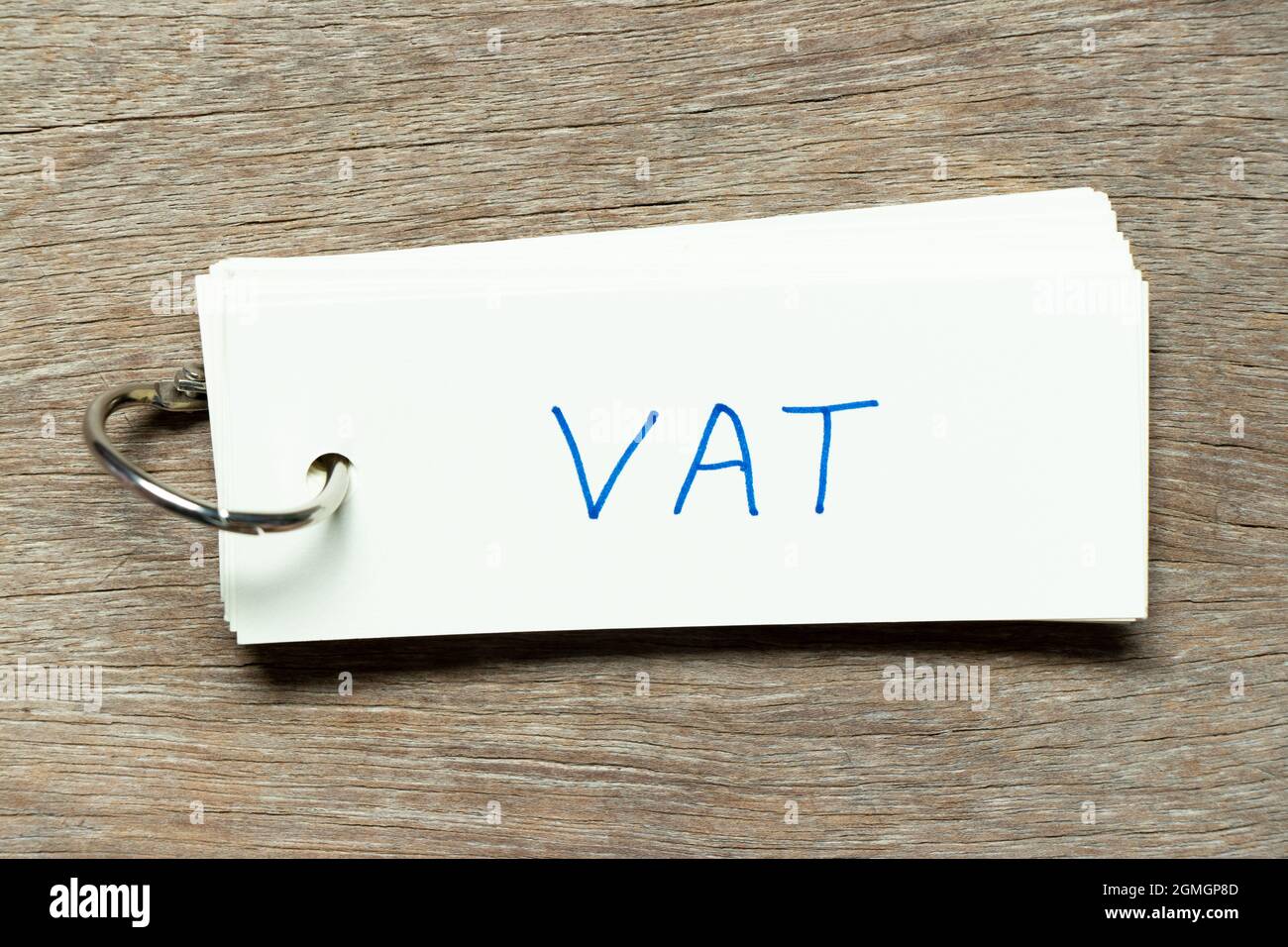 Flash card with handwriting word VAT (abbreviation of value added tax ...