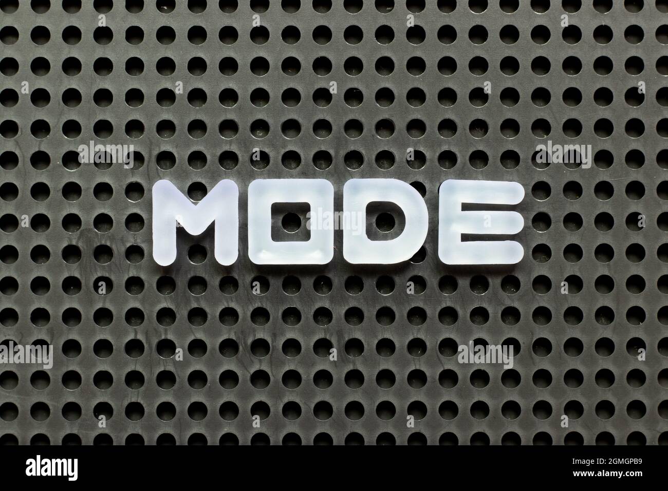 White color letter in word mode on black pegboard background Stock ...