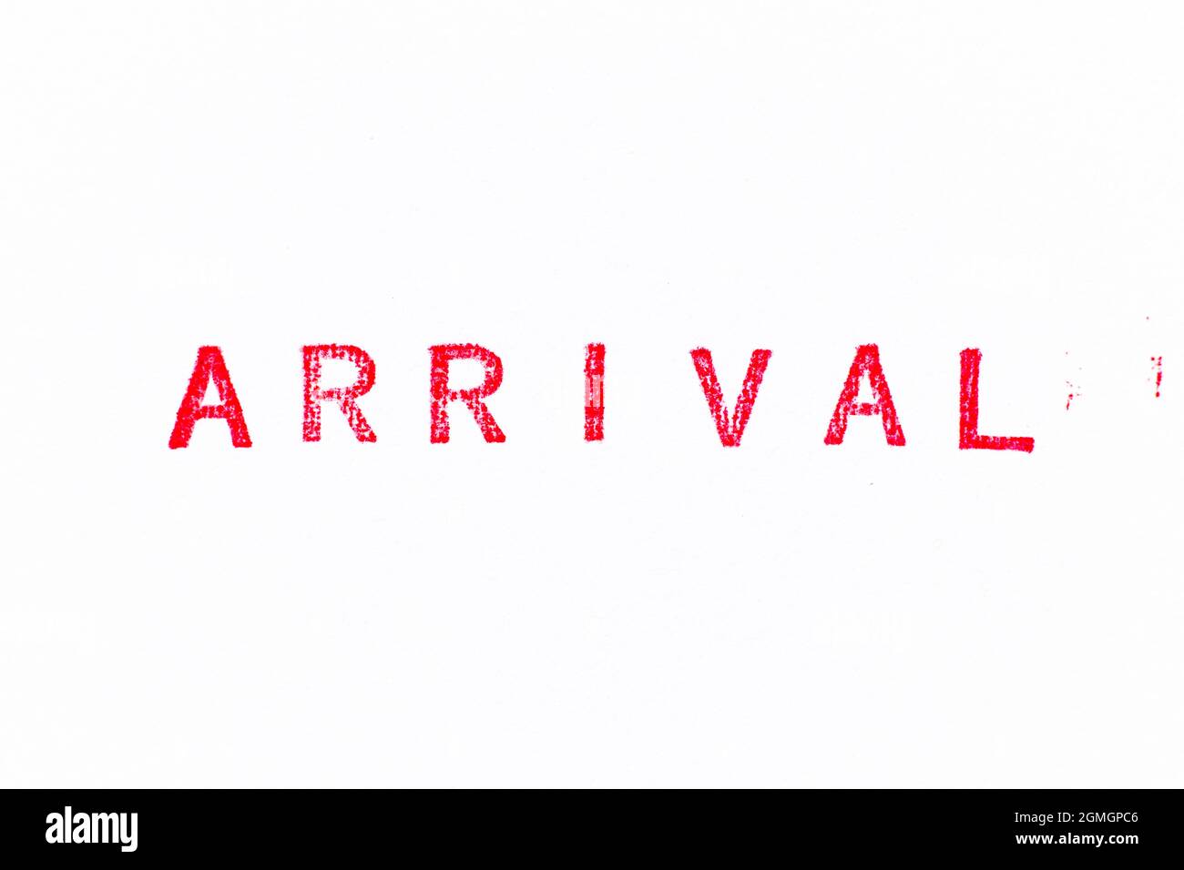 Red color rubber stamp in word arrival on white paper background Stock ...