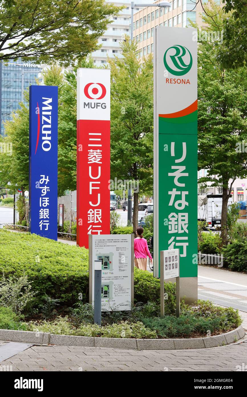 Signs for three Japanese banks - Resona Bank, MUFG and Mizuho - in ...