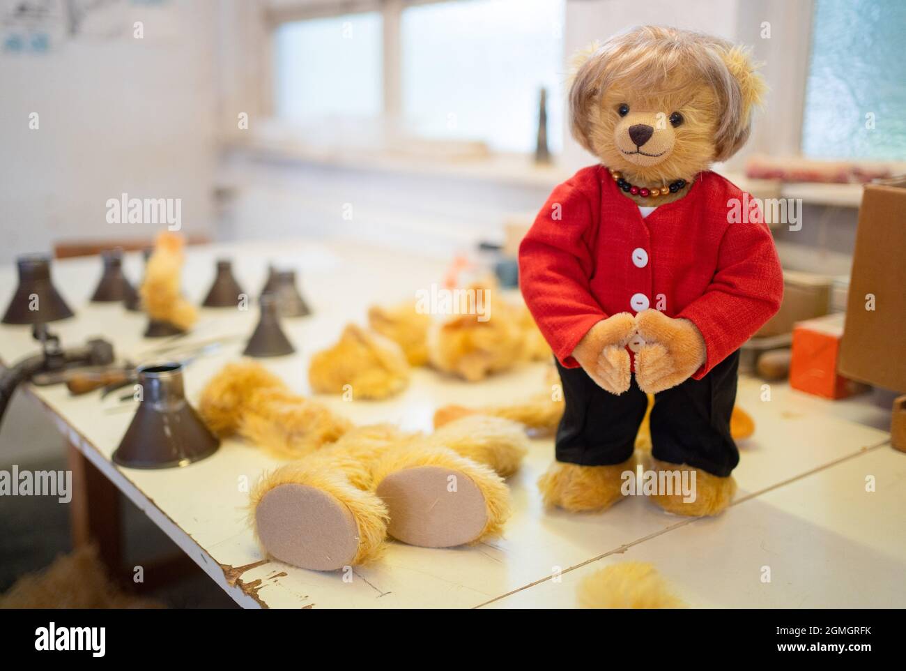 Coburg, Germany. 16th Sep, 2021. Parts of future teddies lie next to a ...