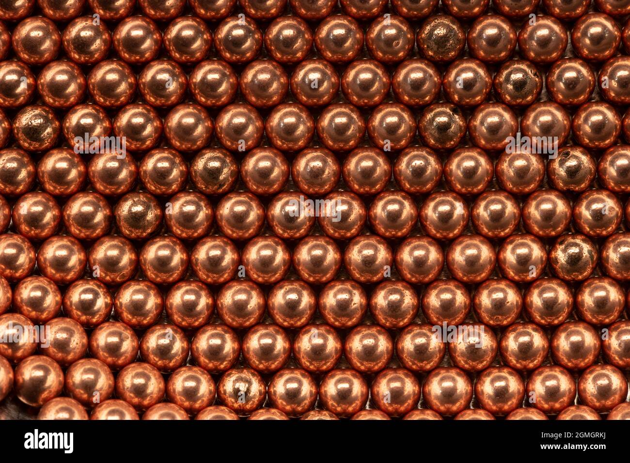 Shiny Copper Ball bearings in orderly rows Stock Photo - Alamy