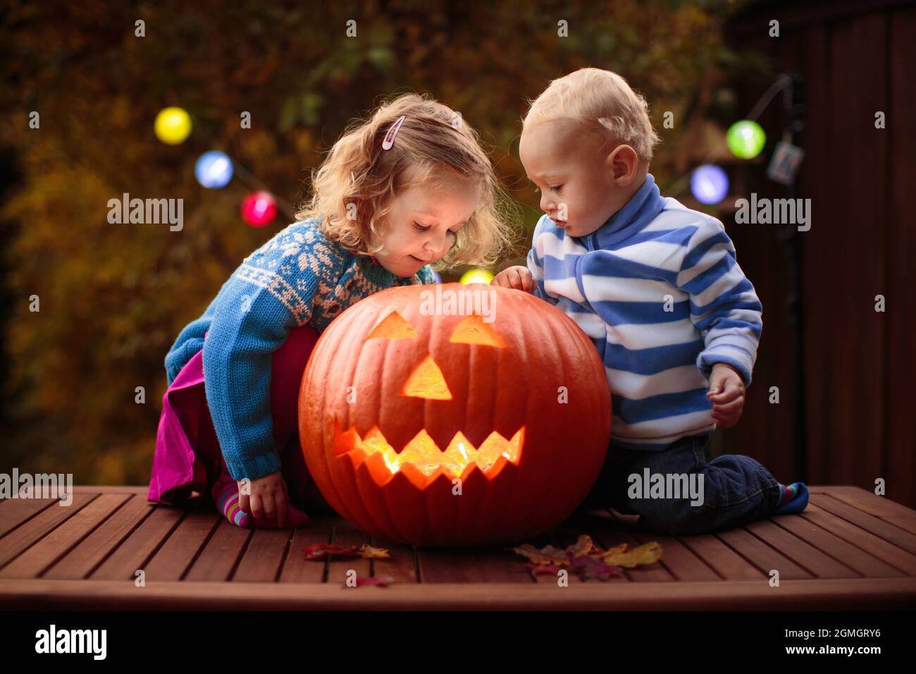 Child carving Halloween pumpkin. Kids carve pumpkins for trick or treat ...