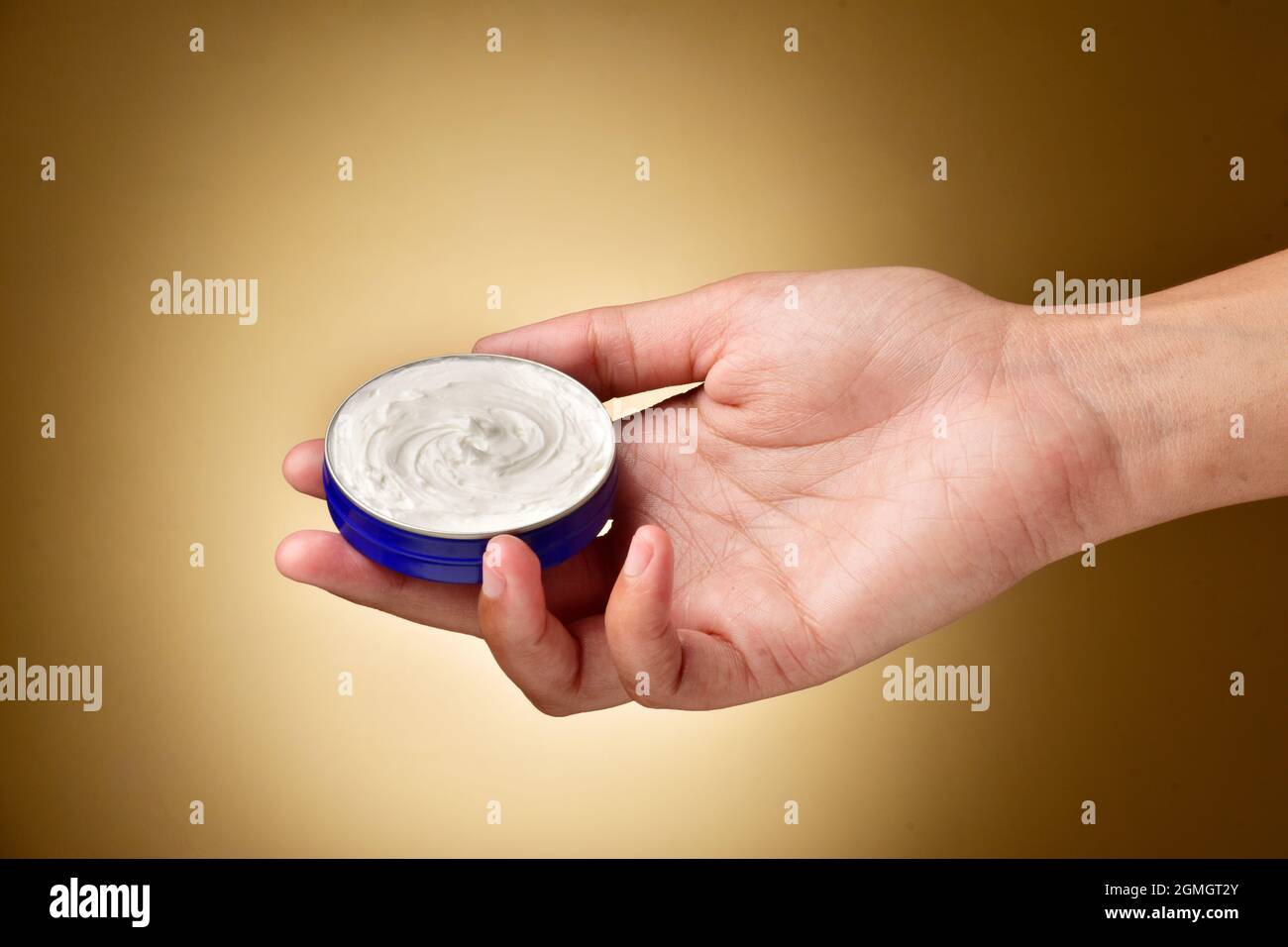 Cosmetic Cream container in Hand Stock Photo - Alamy
