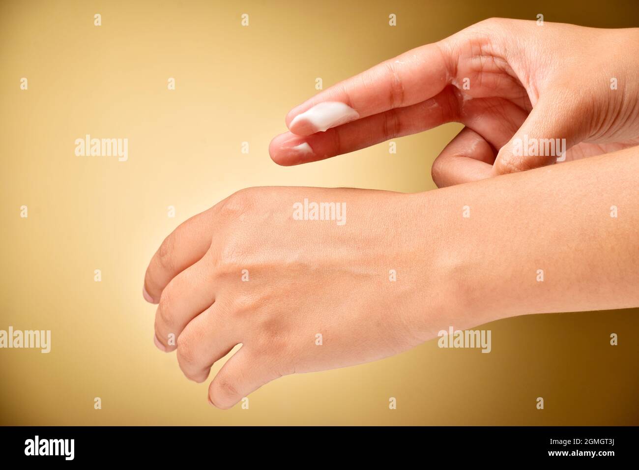 applying moisturizer in hand Stock Photo - Alamy